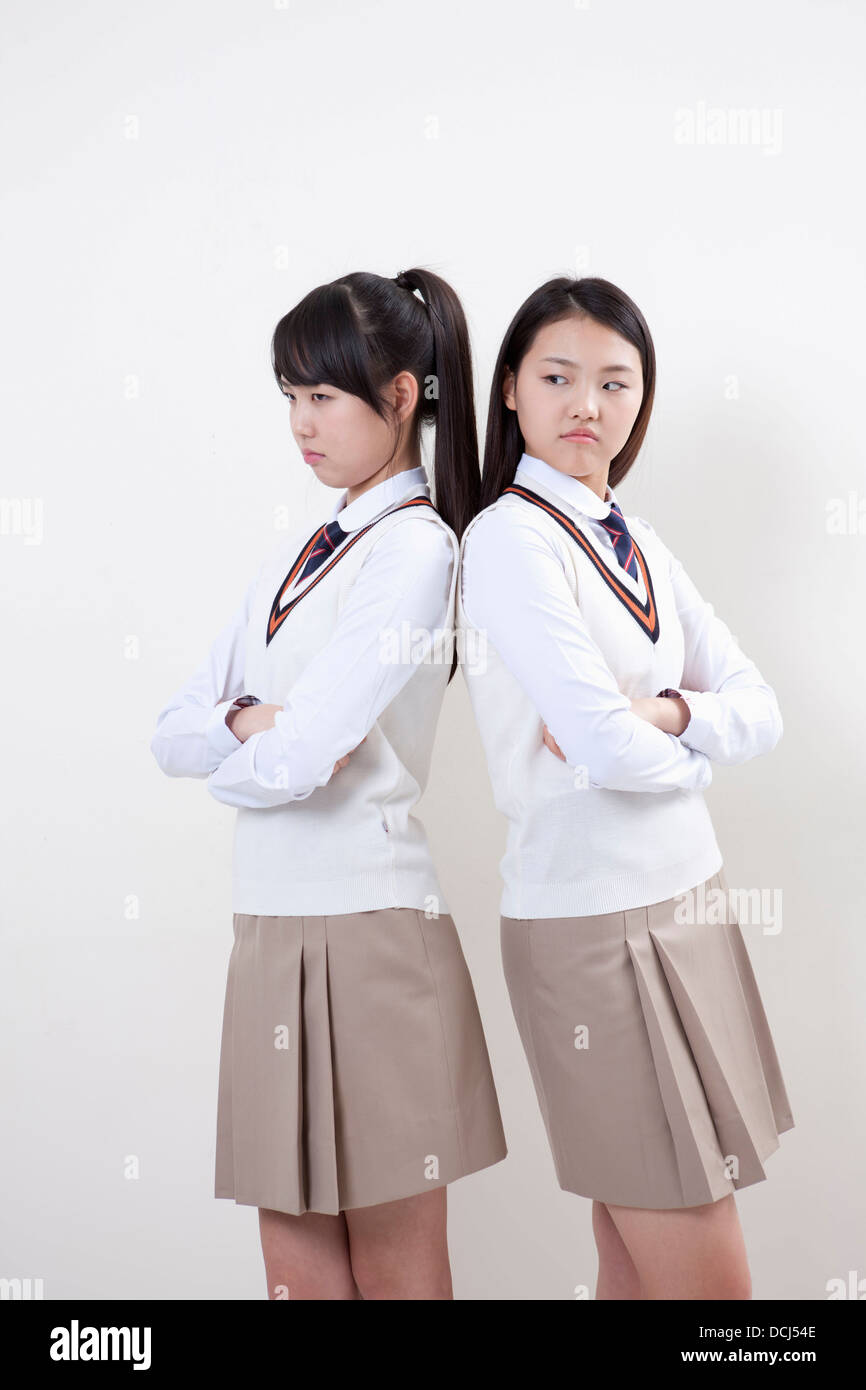 students in uniform standing back to back Stock Photo - Alamy