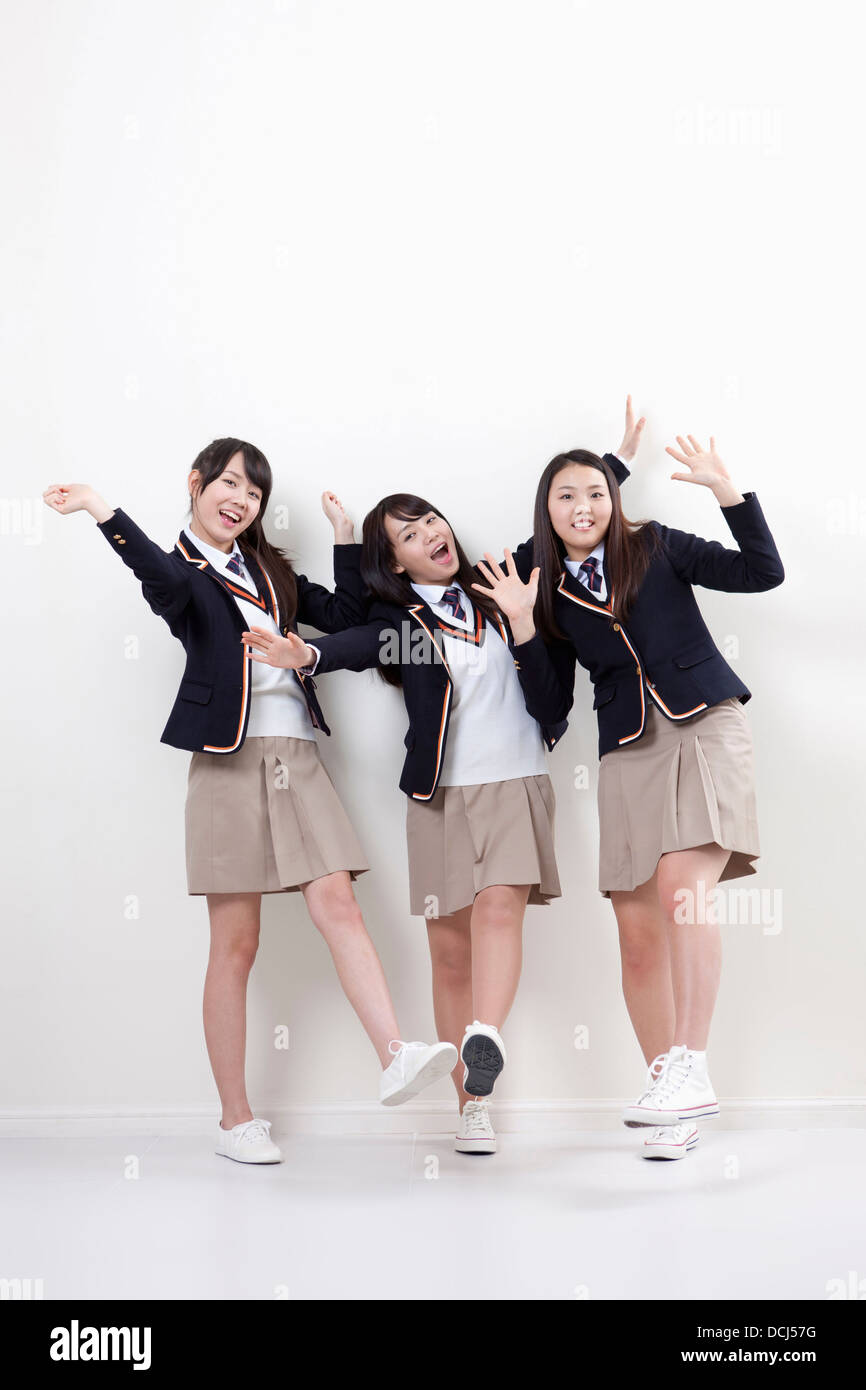 students in uniform posing happily Stock Photo - Alamy