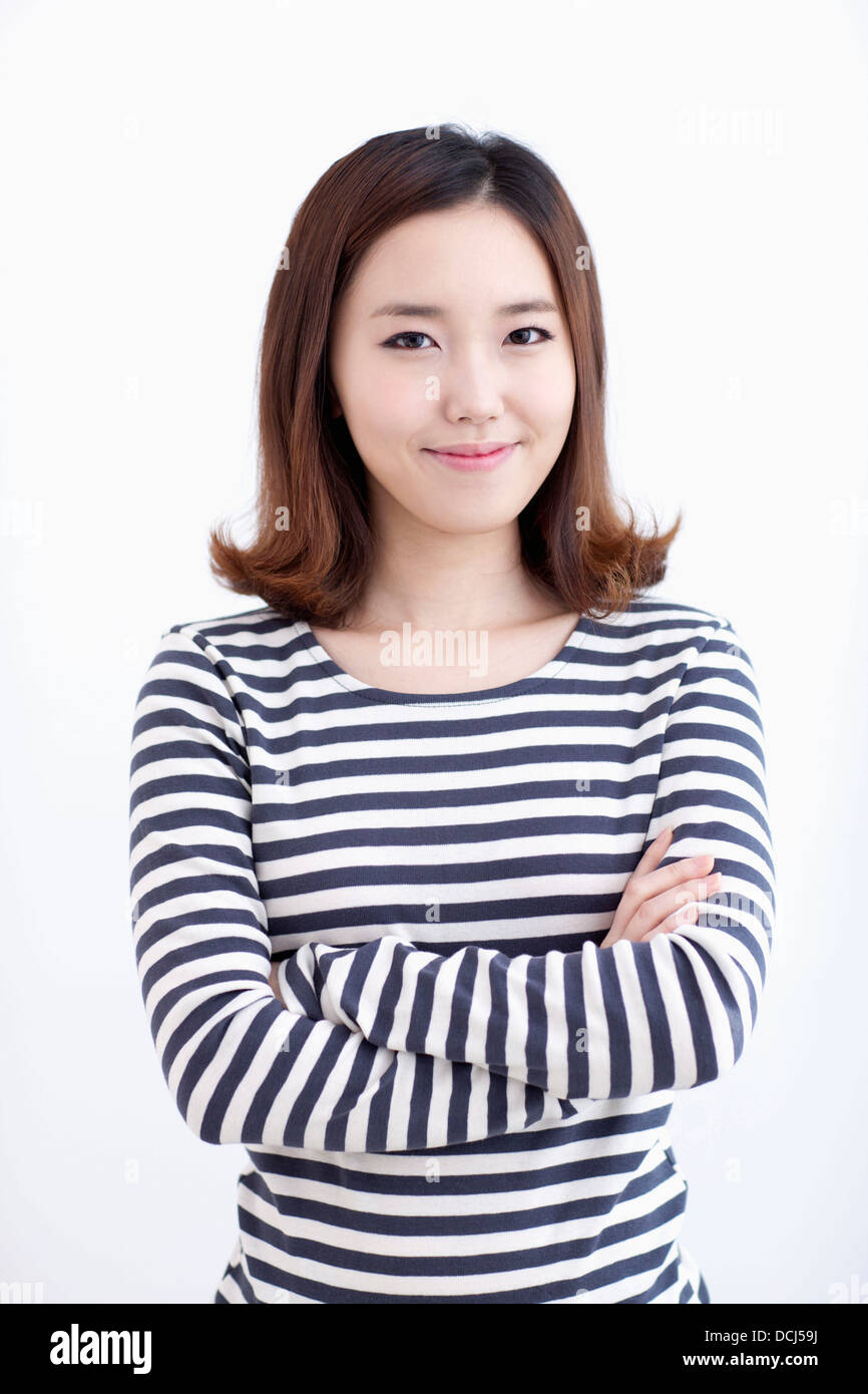 a lady in striped clothes posing Stock Photo - Alamy