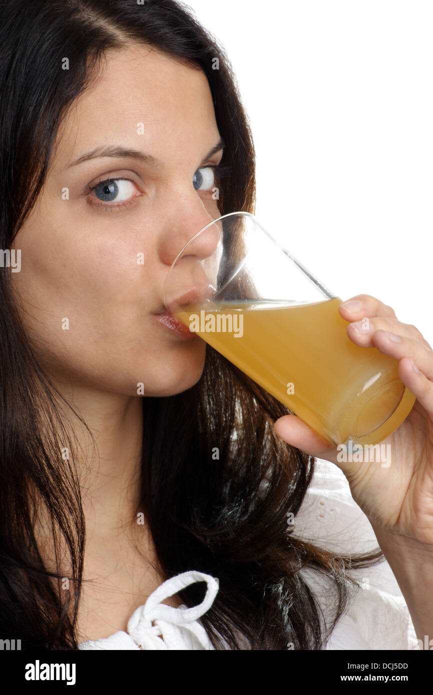 a young woman drinks some cold juice Stock Photo - Alamy