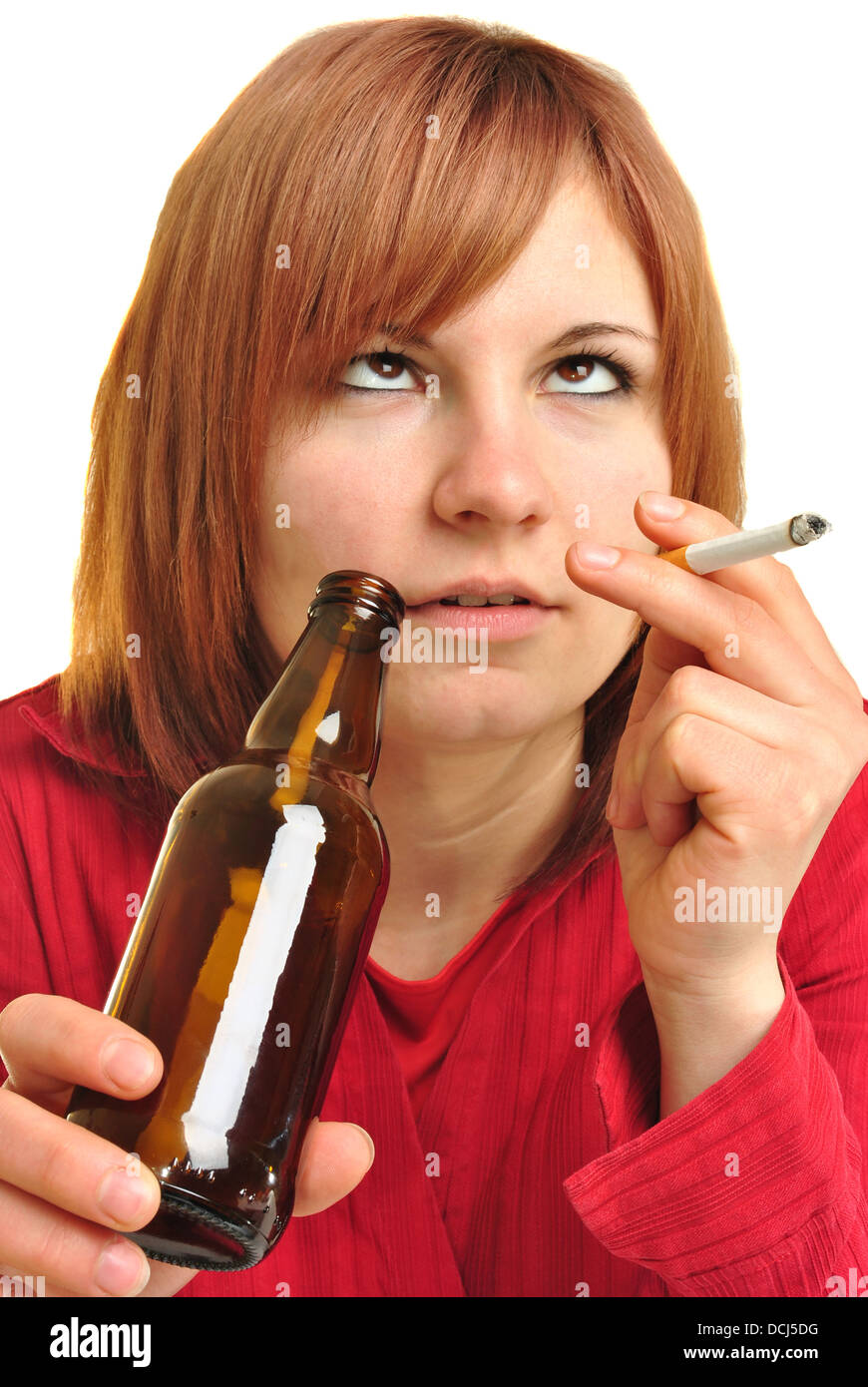 a young woman drinking at her office desk Stock Photo - Alamy