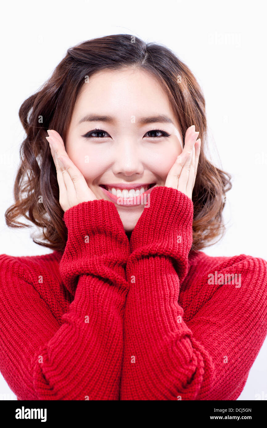a lady in red sweater smiling Stock Photo - Alamy