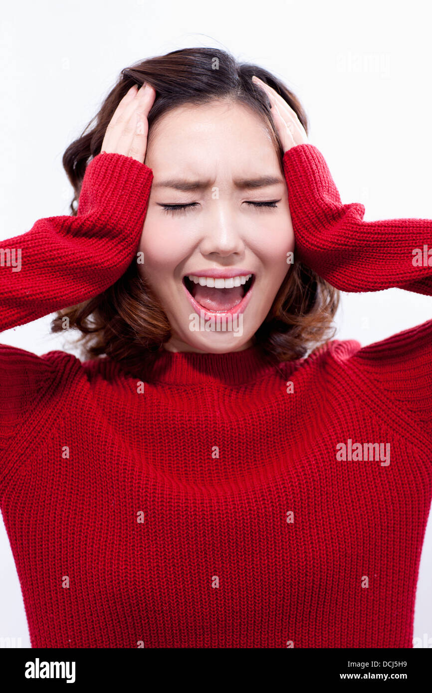 a lady in red sweater looking stressed Stock Photo - Alamy