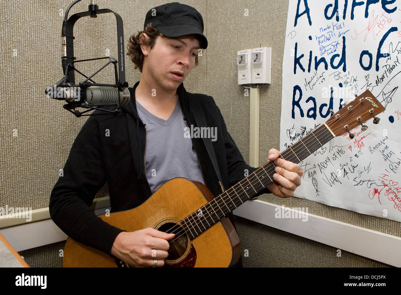 Recording artist Matt Wertz performs in a radio studio in ...
