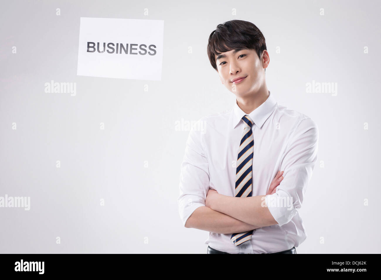 a business man with a paper saying business Stock Photo - Alamy