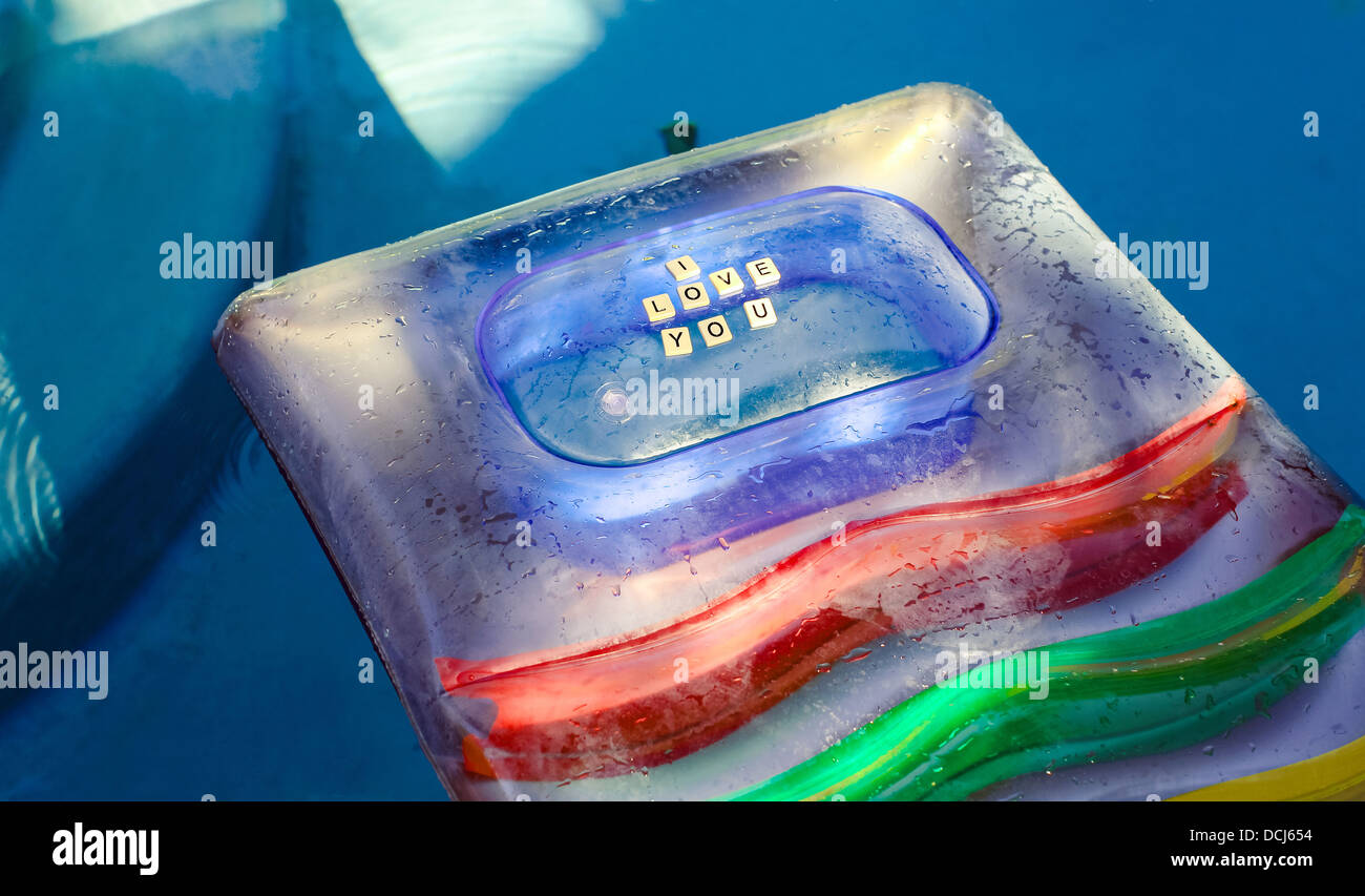 I Love You spelled on a inflatable swimming pool float floating in a ...