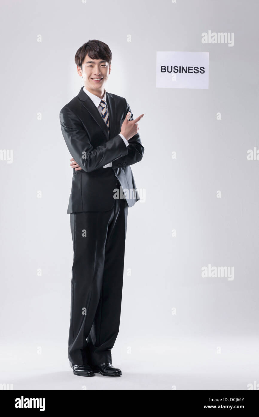 a business man with a paper saying business Stock Photo - Alamy