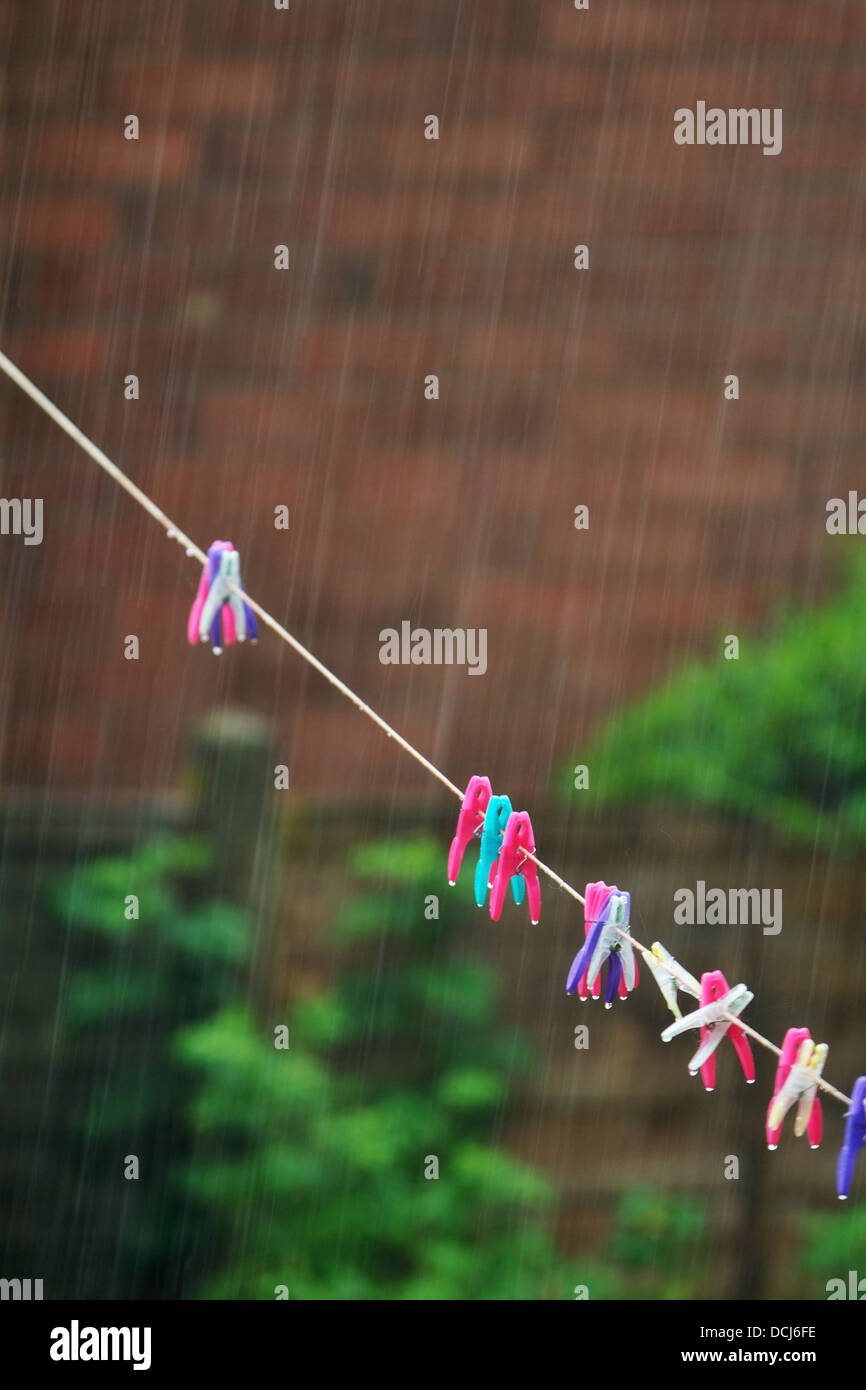 Coloured pegs on a washing line hi-res stock photography and images - Alamy
