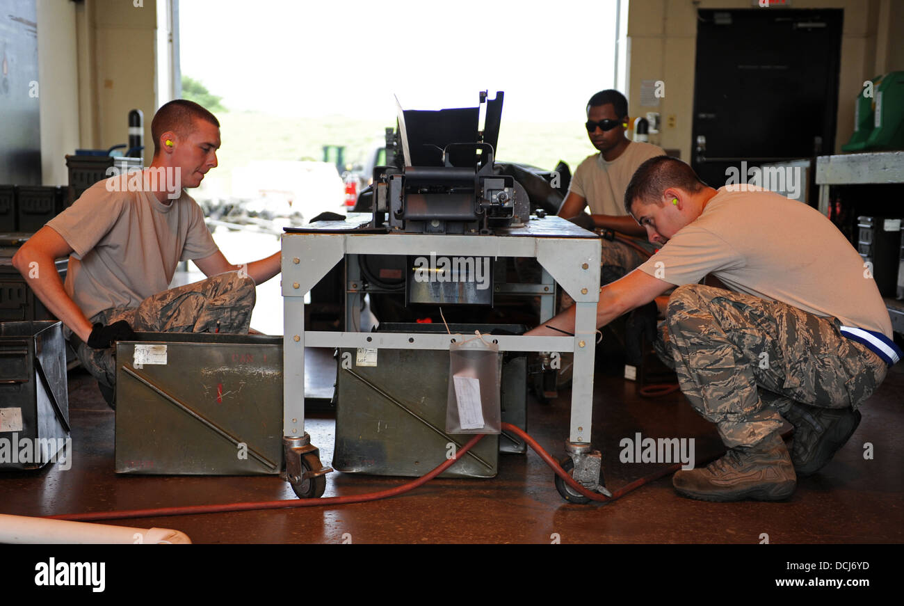 U.S. Air Force Airmen 1st Class Tyler Peterson, left, Junu Johnny, back ...
