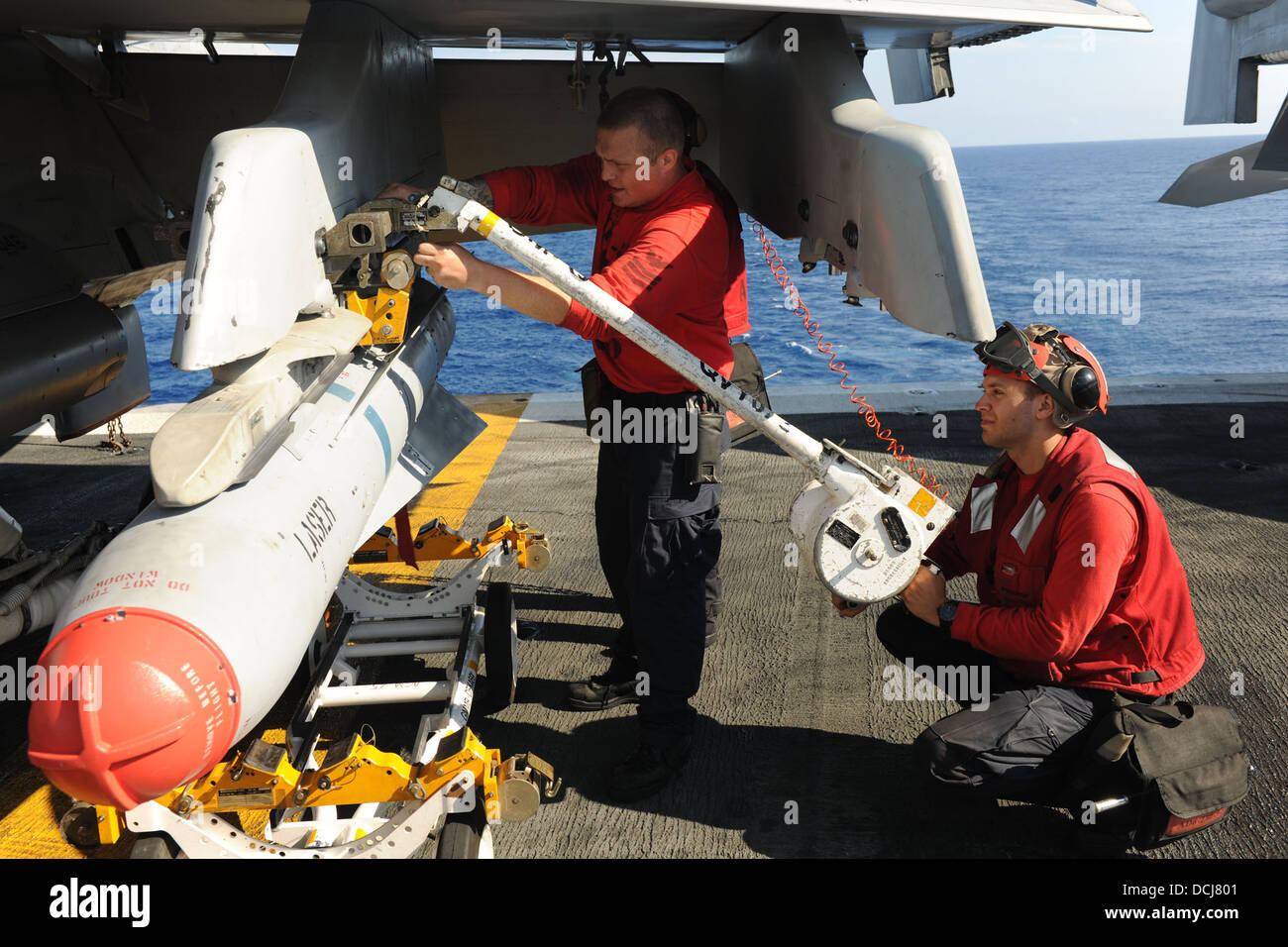 Aviation Ordnanceman 1st Class Matthew Simons, left, from Paris, Ill ...
