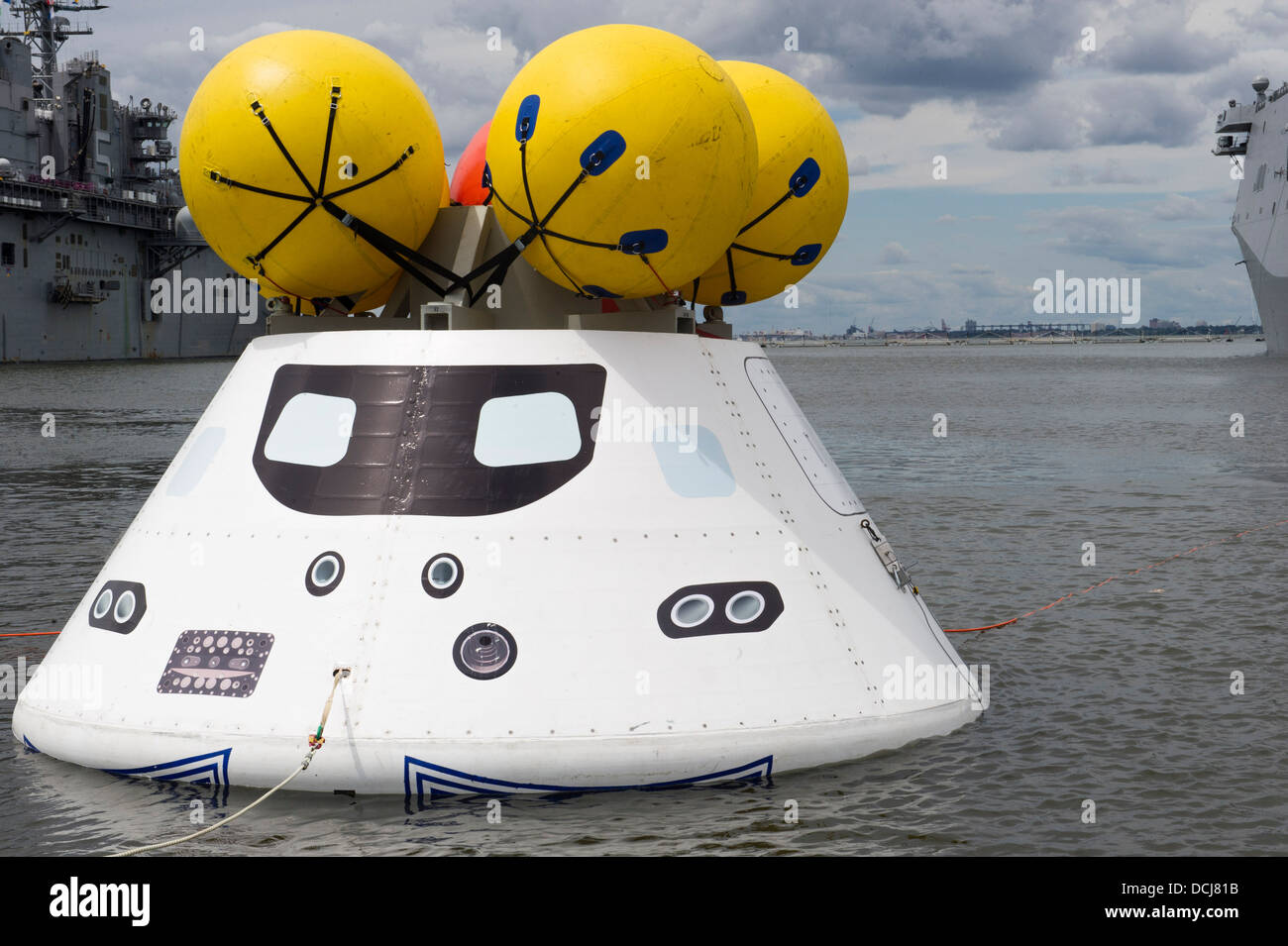 Orion capsule floats before being towed into the well deck of the ...