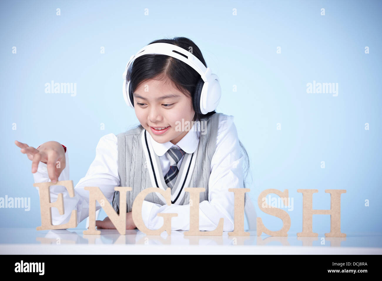 a student with a block of words saying English Stock Photo - Alamy