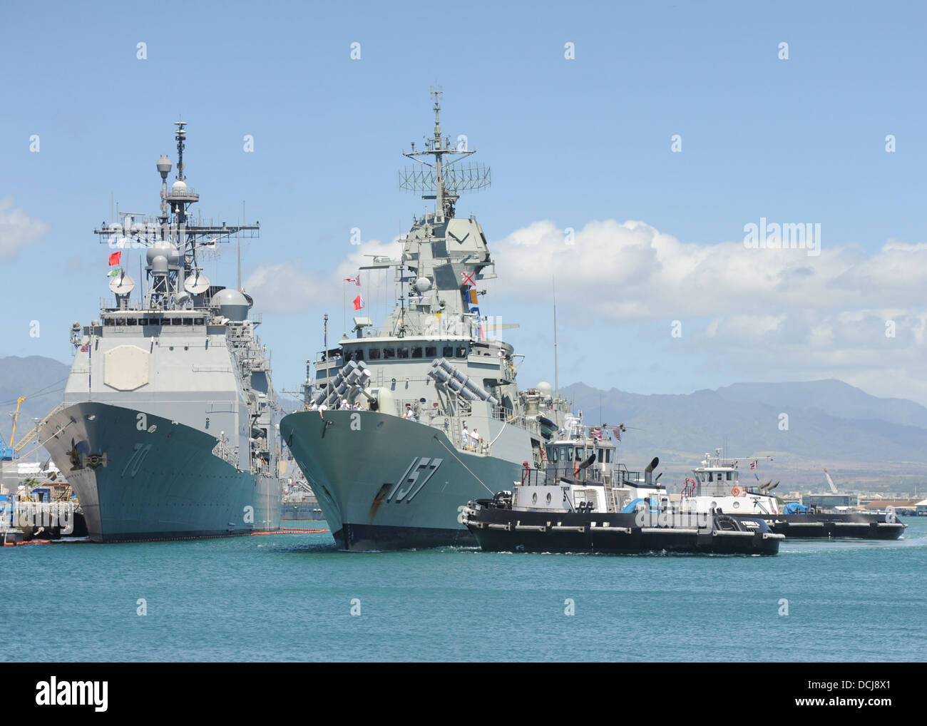 The Royal Australian Navy frigate HMAS Perth (FFGHM 157) passes by USS ...