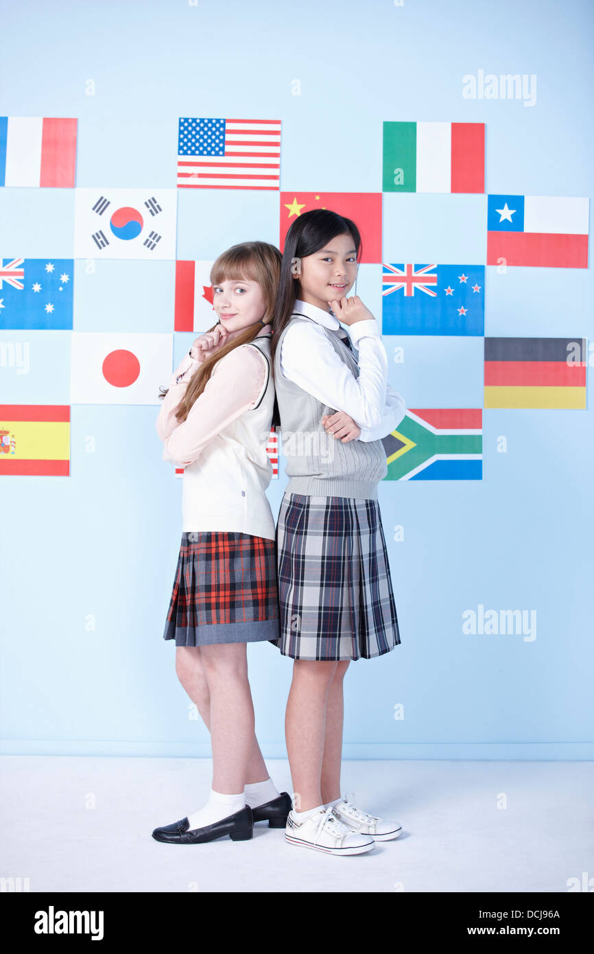 students in uniform standing in front of international flags Stock ...
