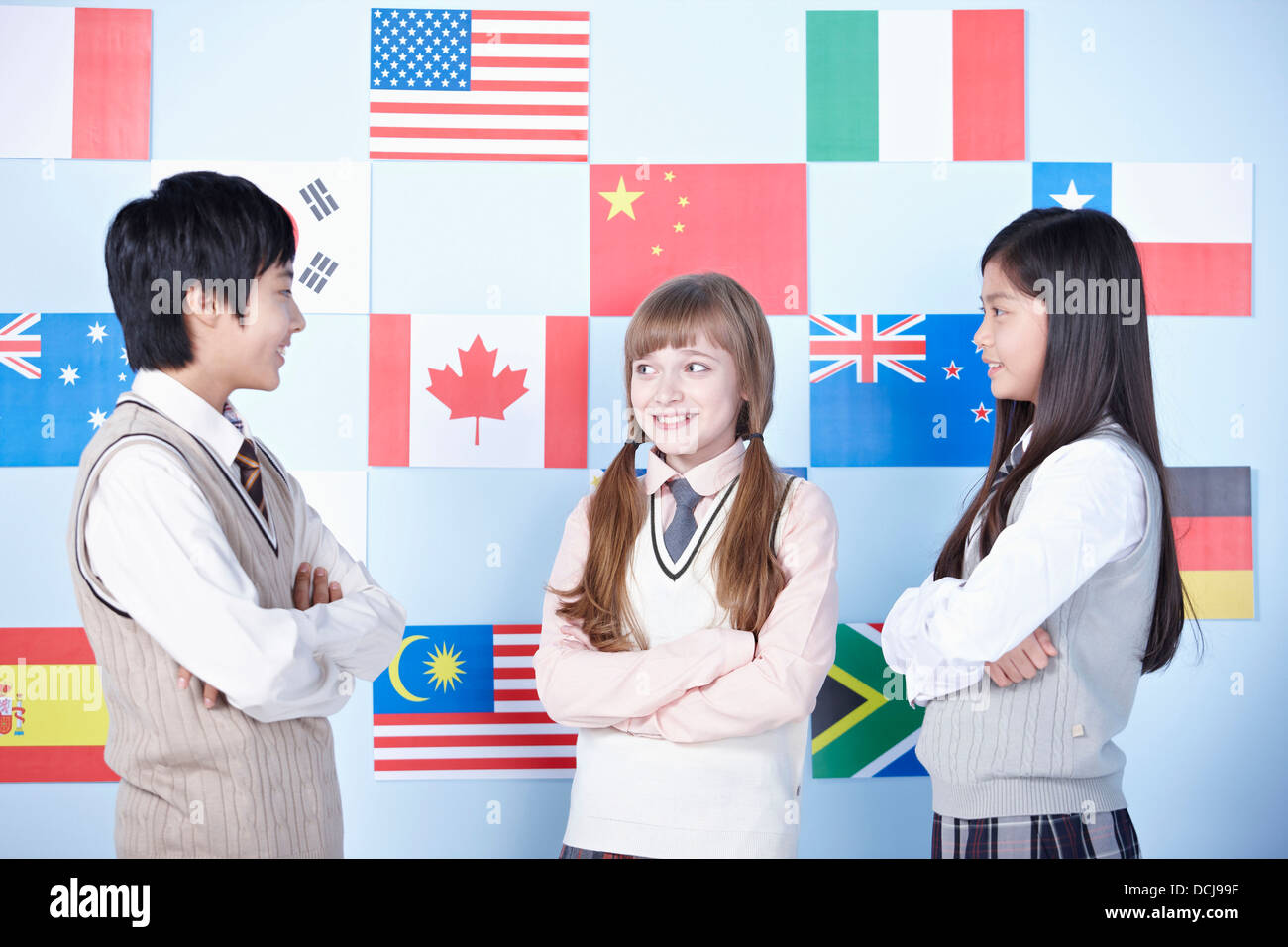 students in uniform standing in front of international flags Stock ...