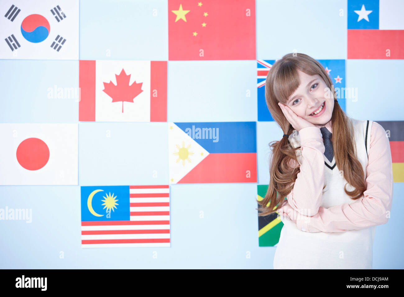 a student in uniform posing in front of international flags Stock Photo ...