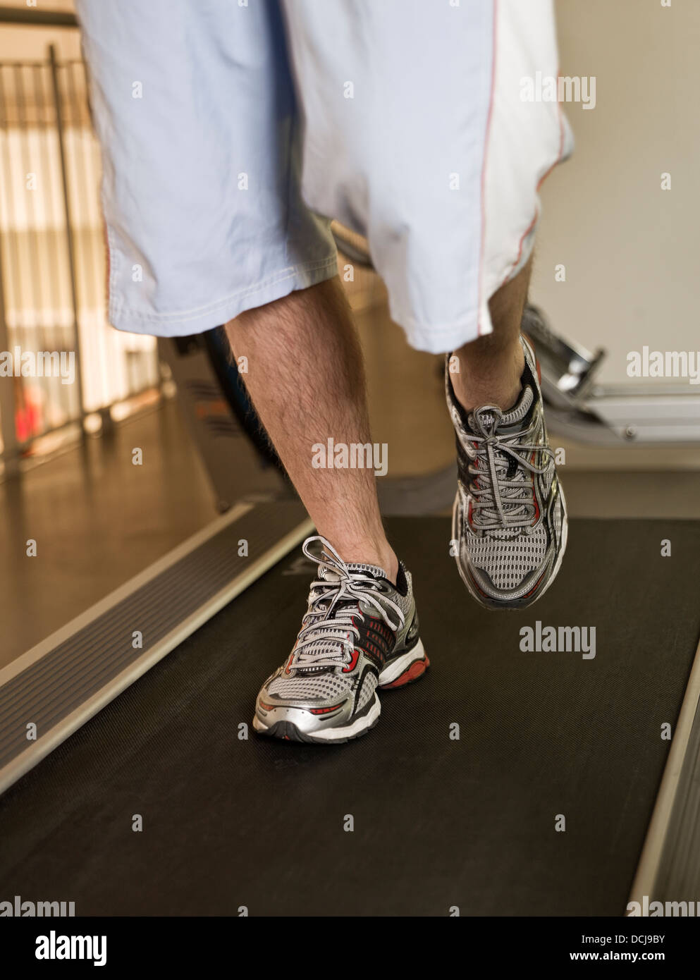 Man running on a treadmill Stock Photo - Alamy