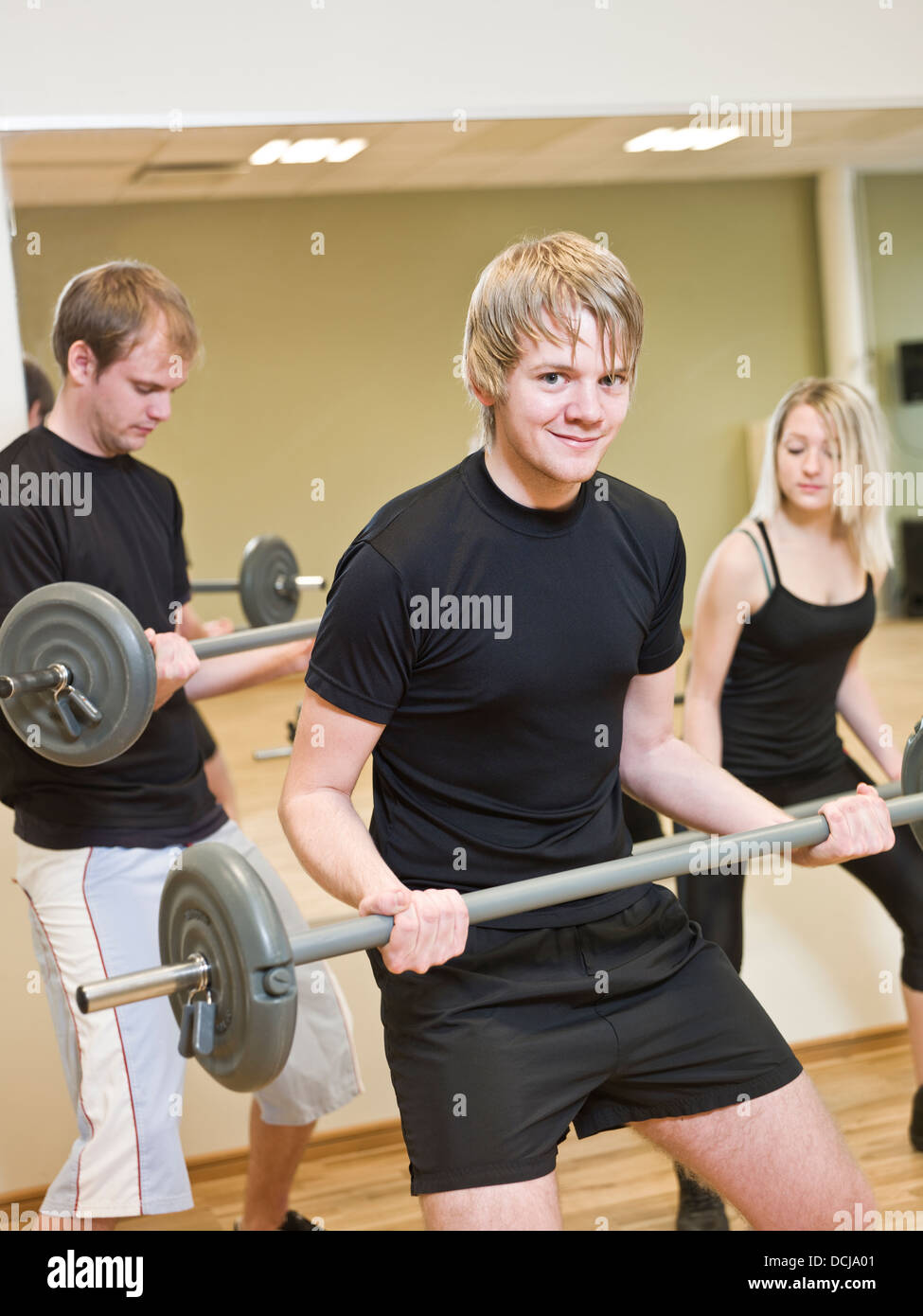 Group of people lifting weights Stock Photo - Alamy