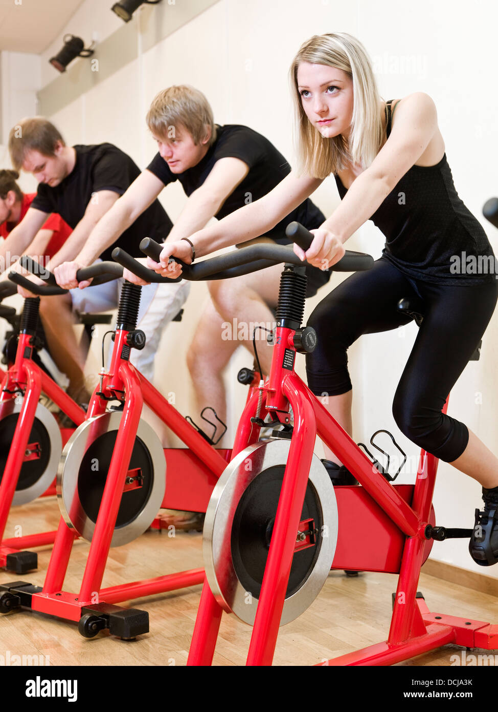Group of people having spinning class Stock Photo - Alamy