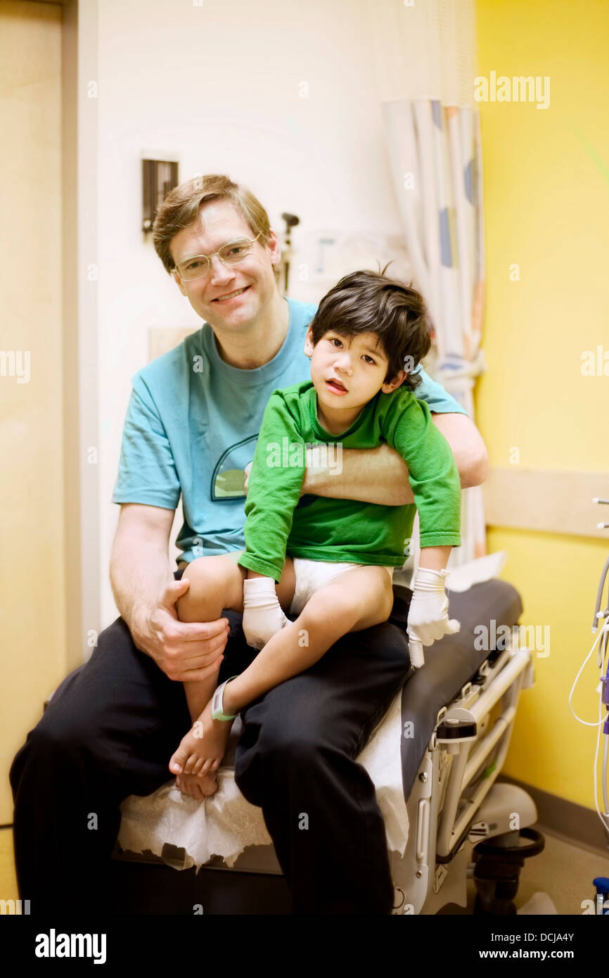 Father and child is doctor's office Stock Photo - Alamy