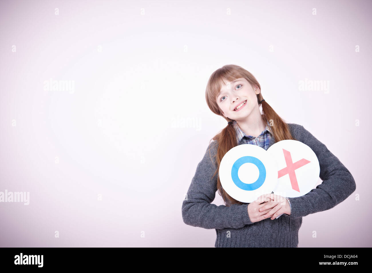 a girl holding boards saying correct and wrong Stock Photo - Alamy