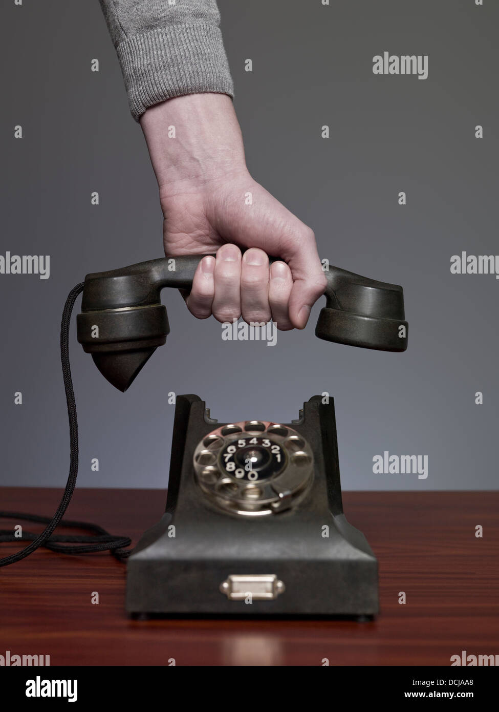 Old person picking up telephone hi-res stock photography and images - Alamy