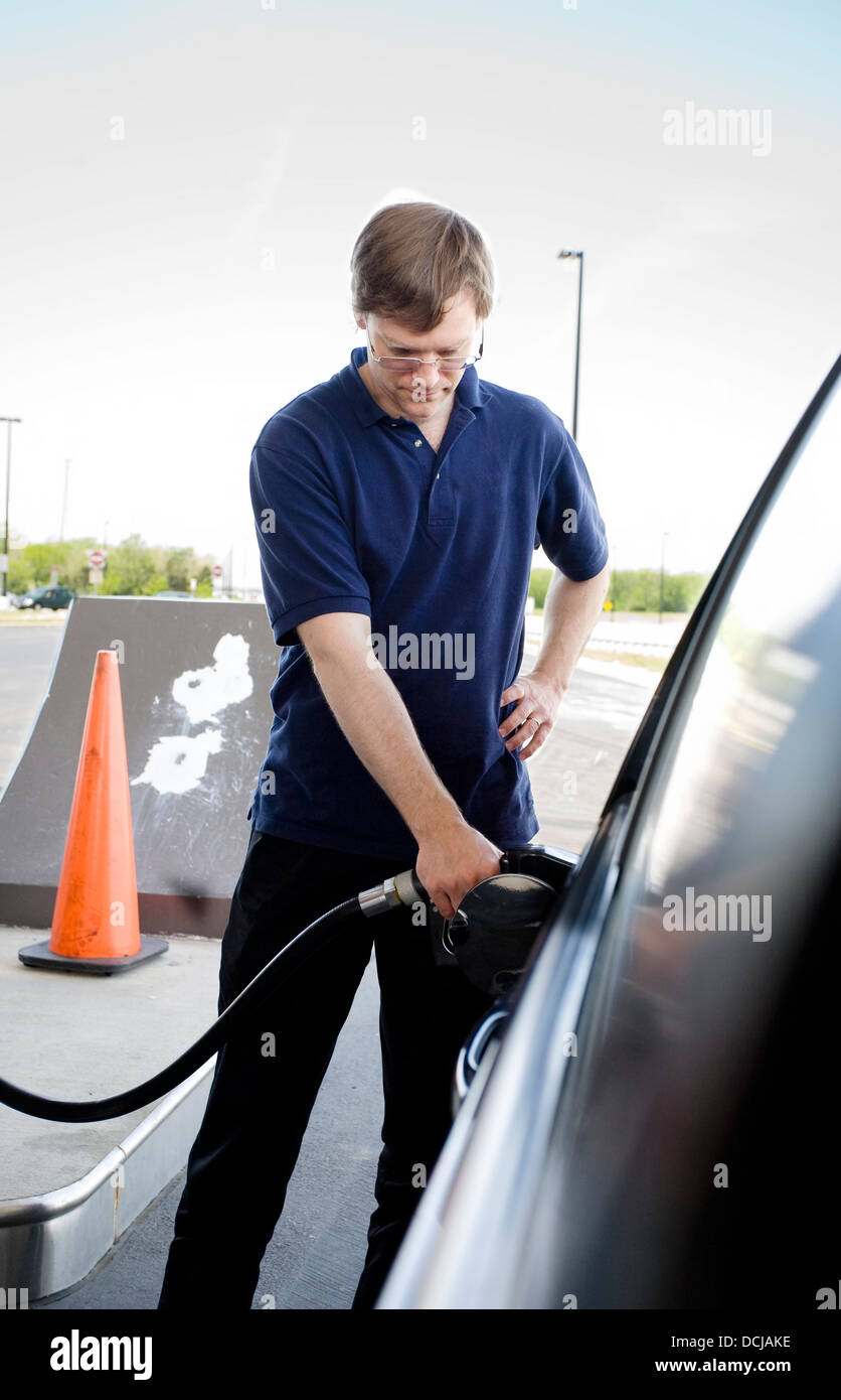 Man pumping gasoline Stock Photo - Alamy