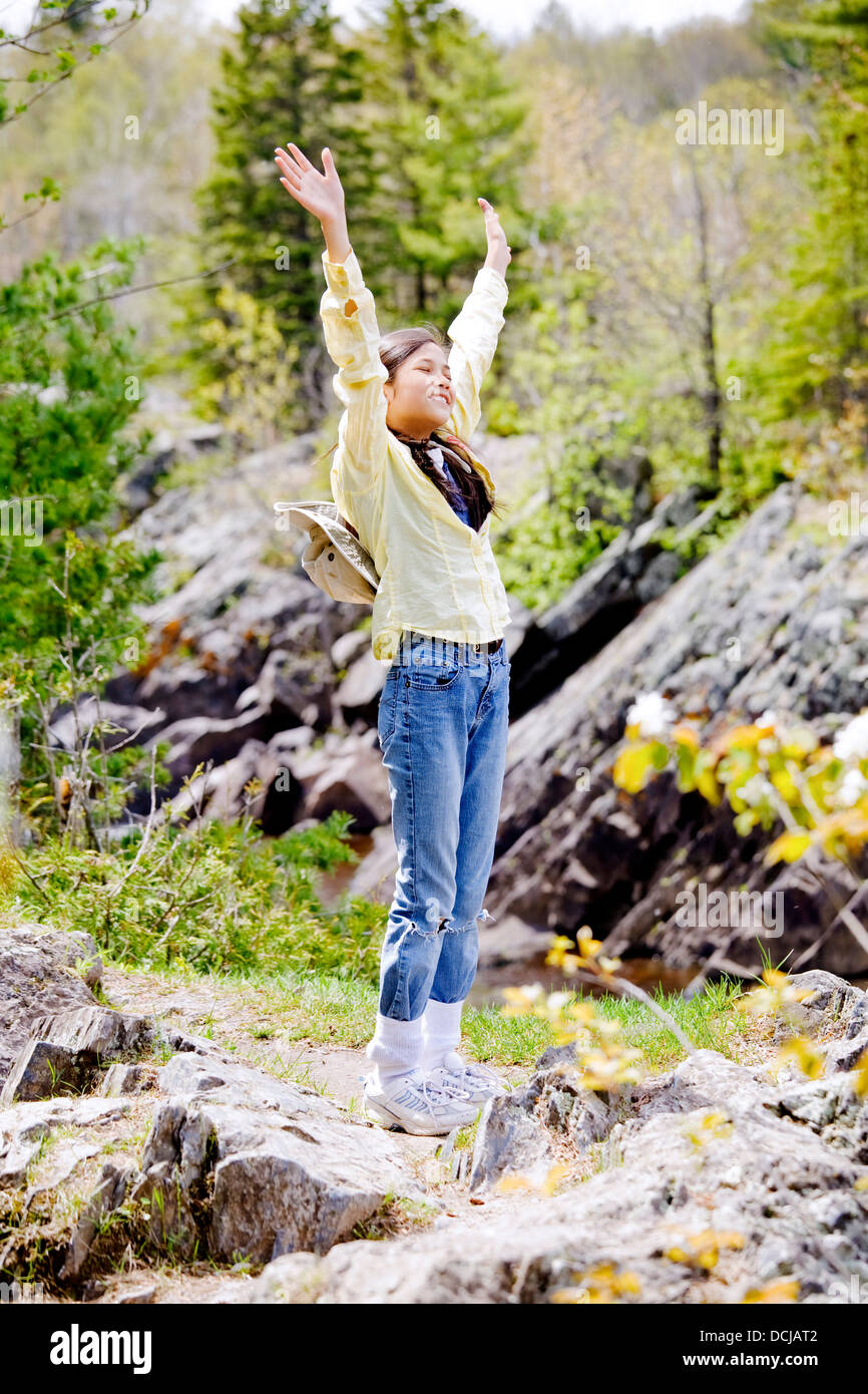 Girl raising hands in praise Stock Photo - Alamy