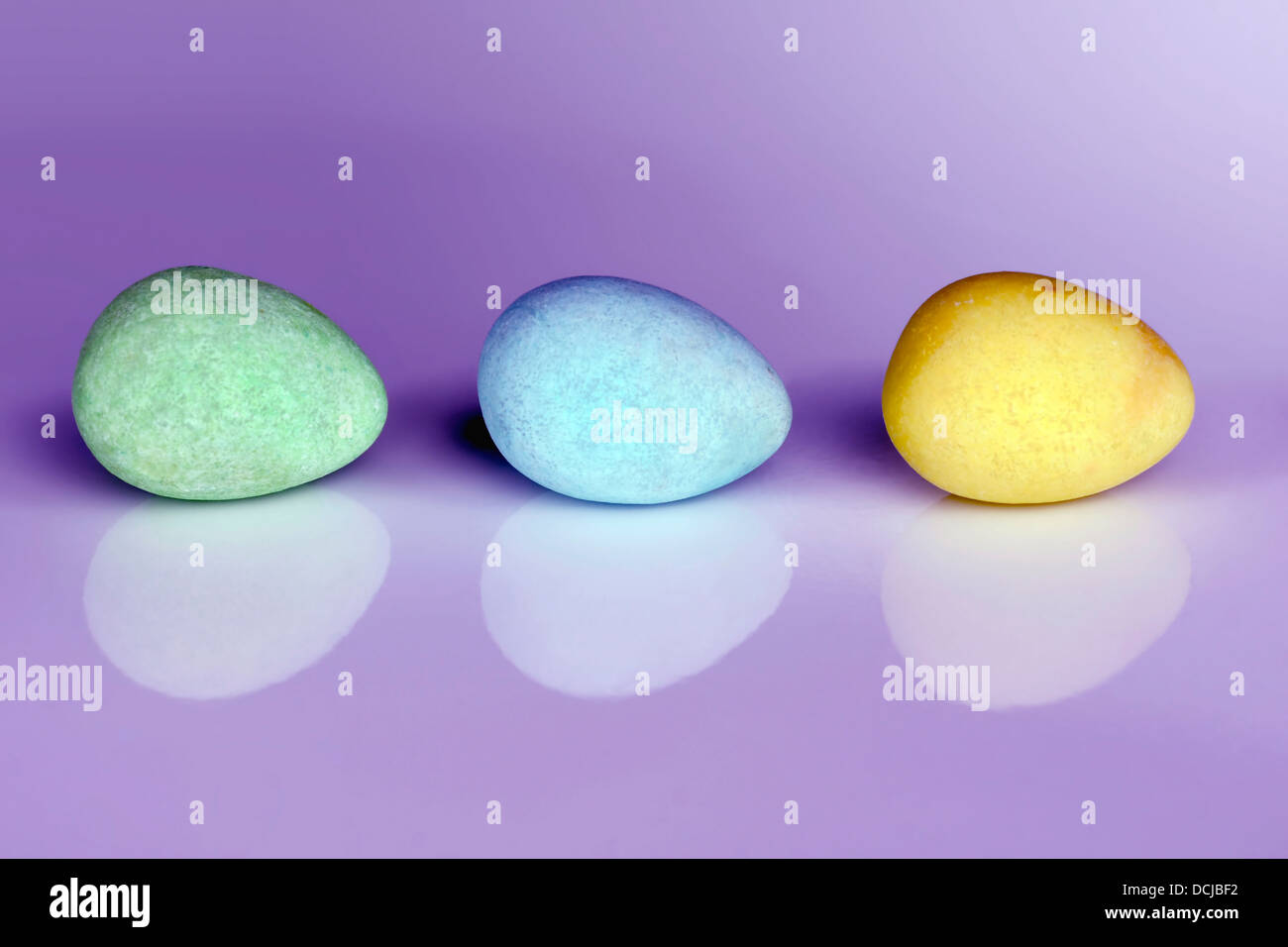 Fun Easter eggs in a row Stock Photo - Alamy