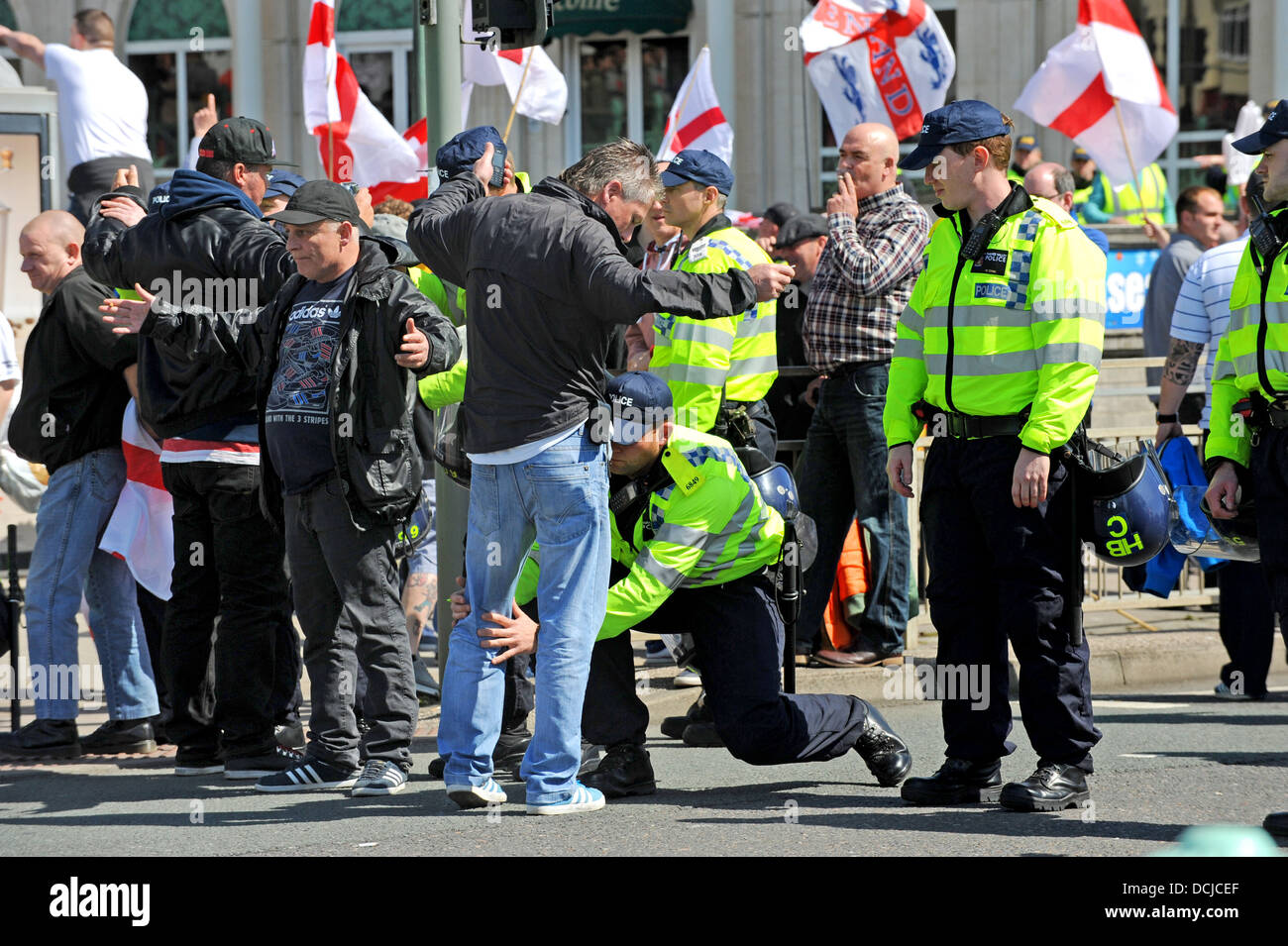 Police search members of the English Defence League before an EDL march ...