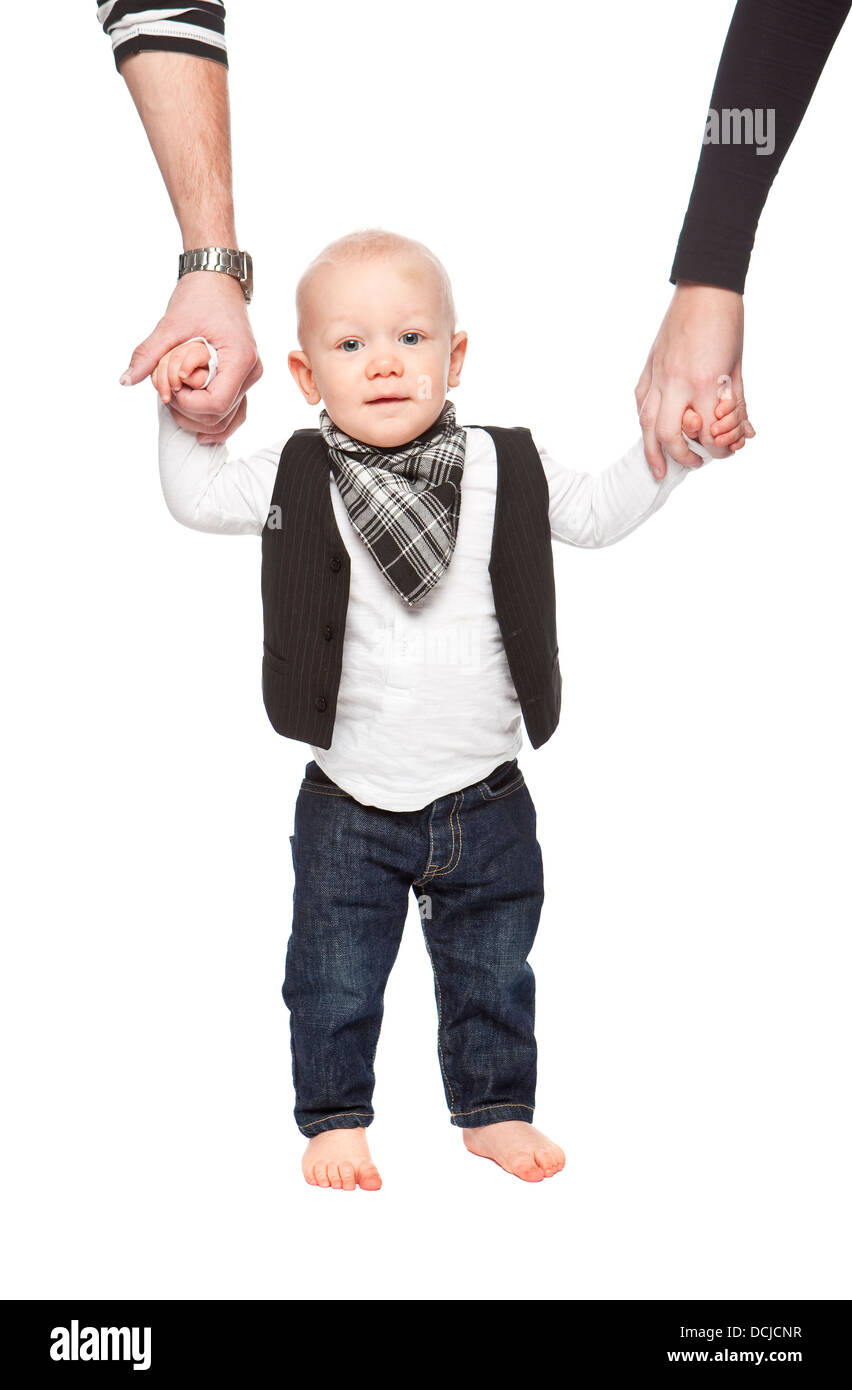 Young baby holding hands with his parents Stock Photo - Alamy
