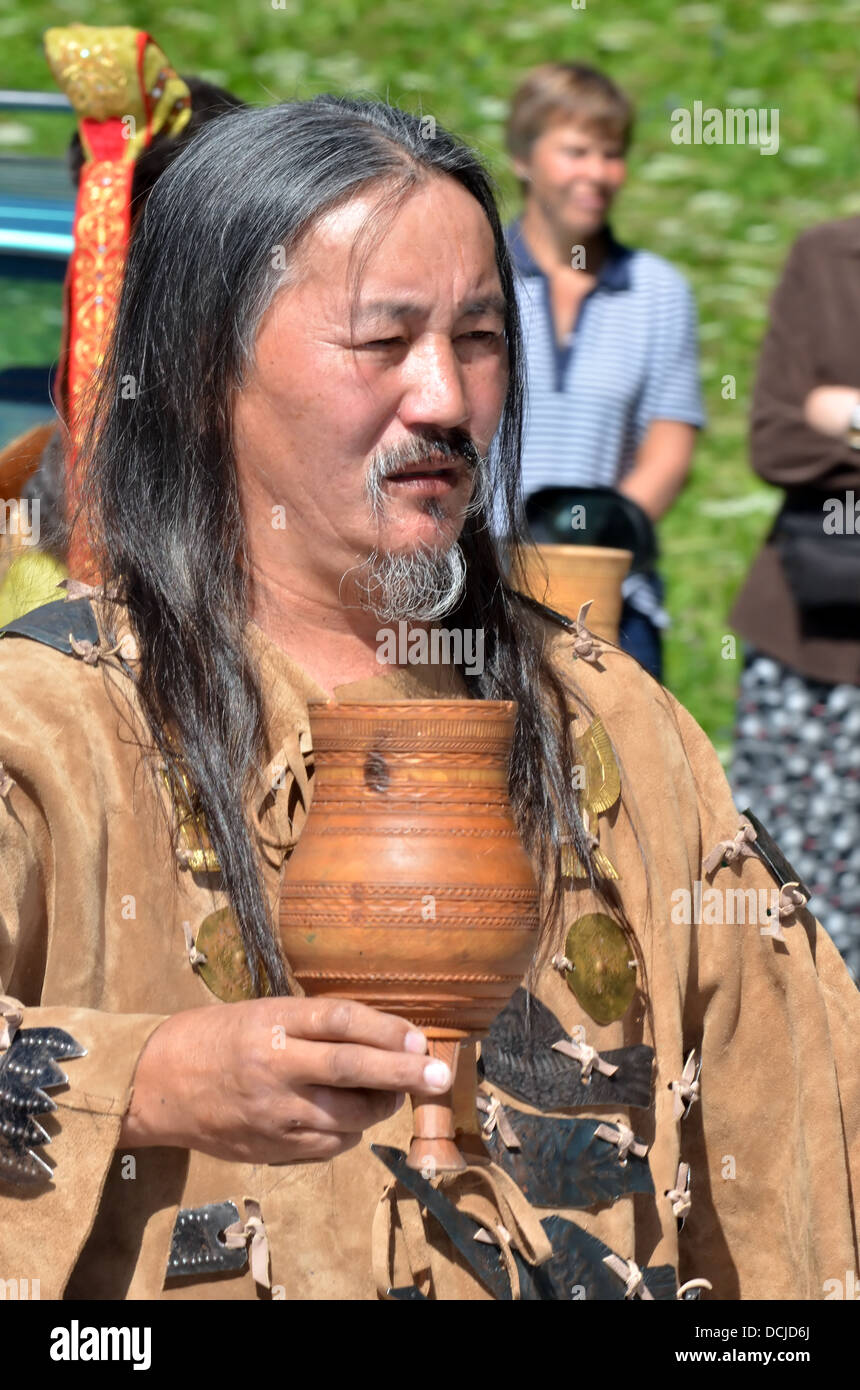 Yakutsk dancers holding ceremonial wooden beakers at the International ...