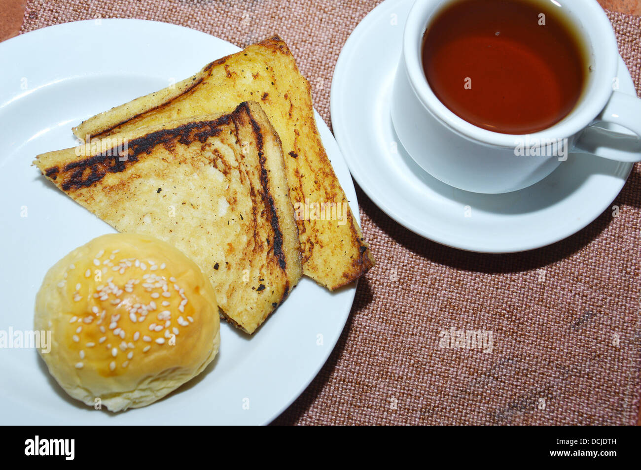 toast on white plate and a cup of tea Stock Photo - Alamy