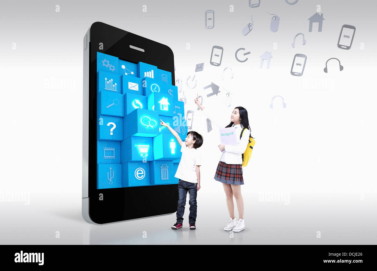 kids pressing on icons in a huge mobile phone Stock Photo - Alamy