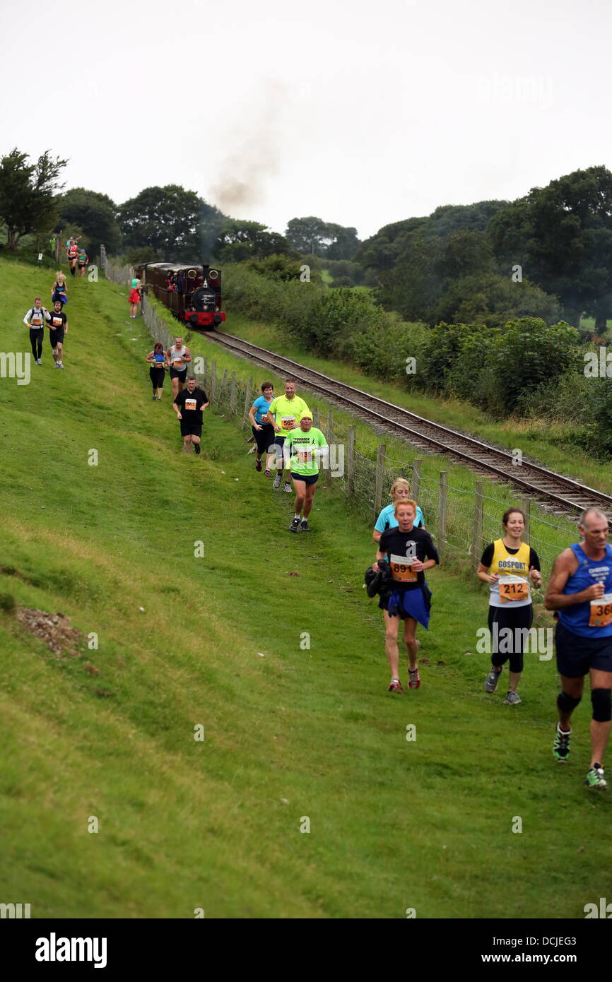 Tywyn, Wales, UK, Saturday, 17 August 2013 Pictured: Runners racing ...