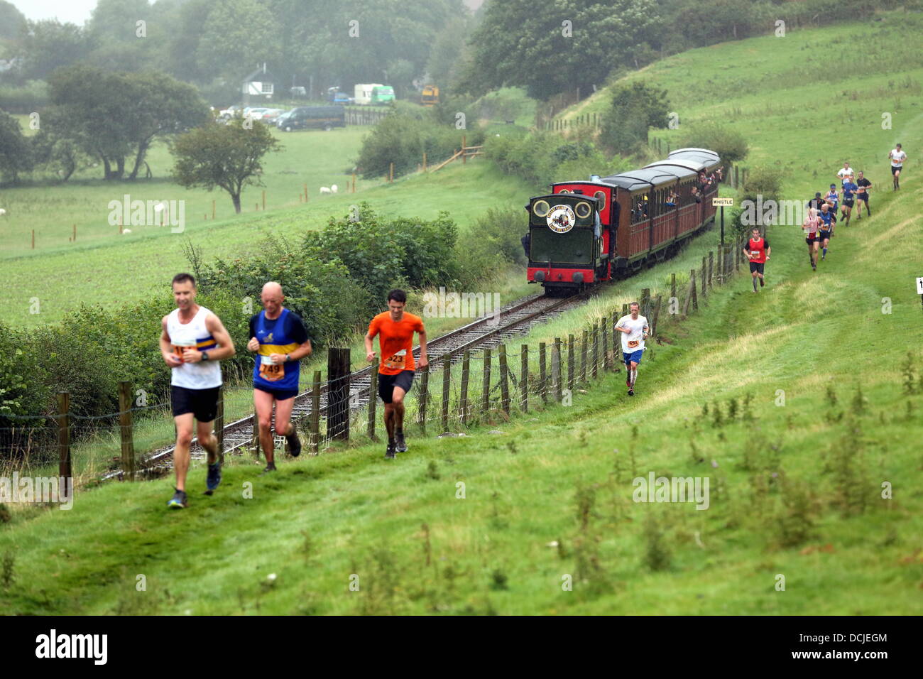 Tywyn, Wales, UK, Saturday, 17 August 2013 Pictured: Runners racing ...