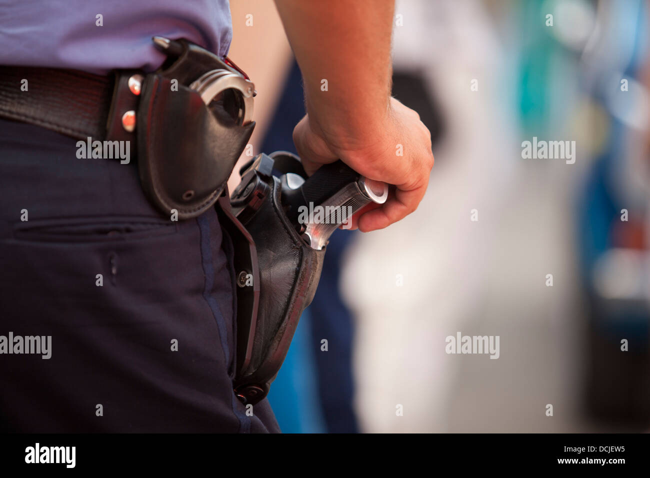 Policeman With Gun High Resolution Stock Photography and Images - Alamy