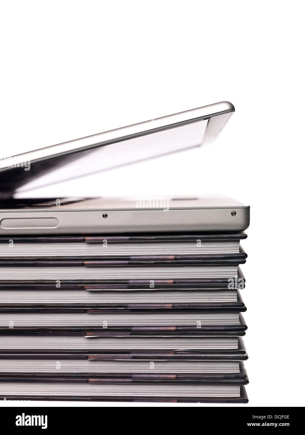 Laptop on top of books Stock Photo - Alamy