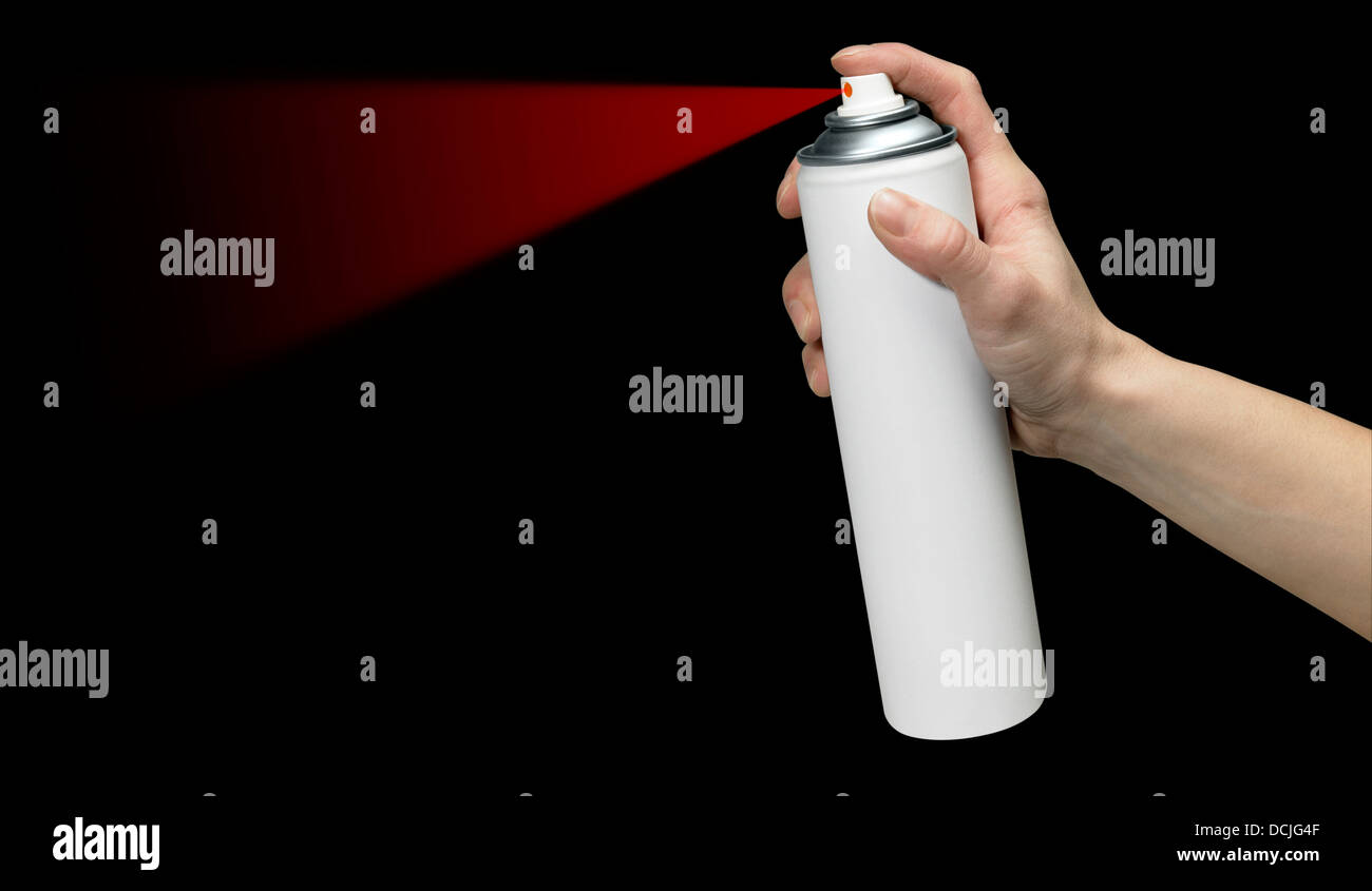 human hand holding a unlabeled white aerosol can with red spray in ...