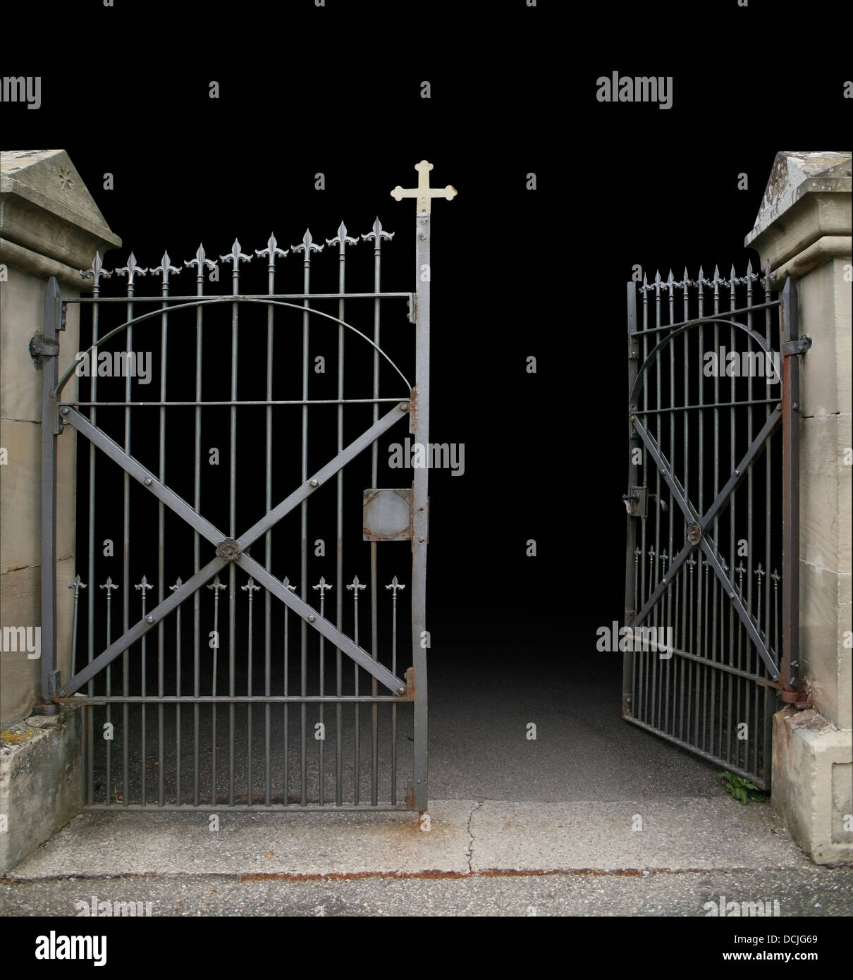 entrance of a graveyard with a open wrought-iron gate in dark gradient ...