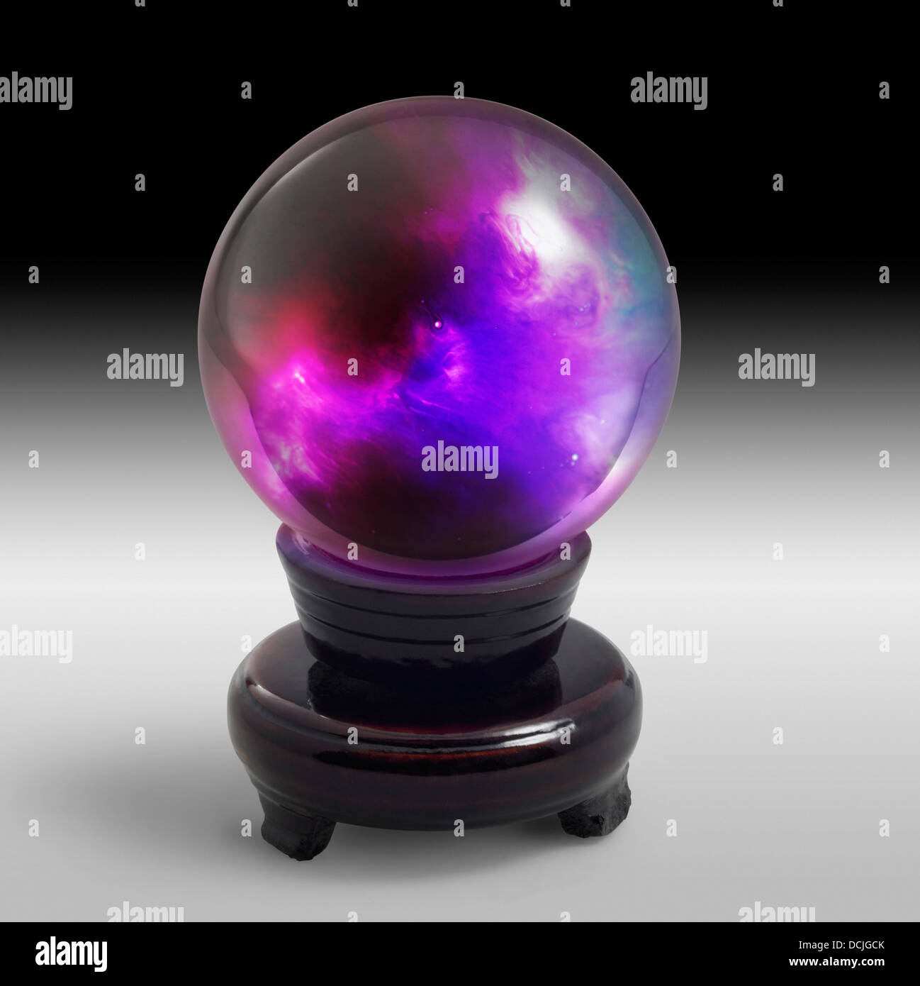 a mystic crystal ball with colorful scenery inside and stand in ...