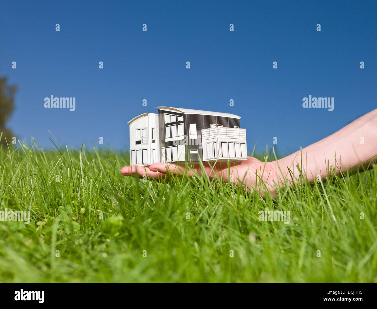 Hand holding a house Stock Photo - Alamy
