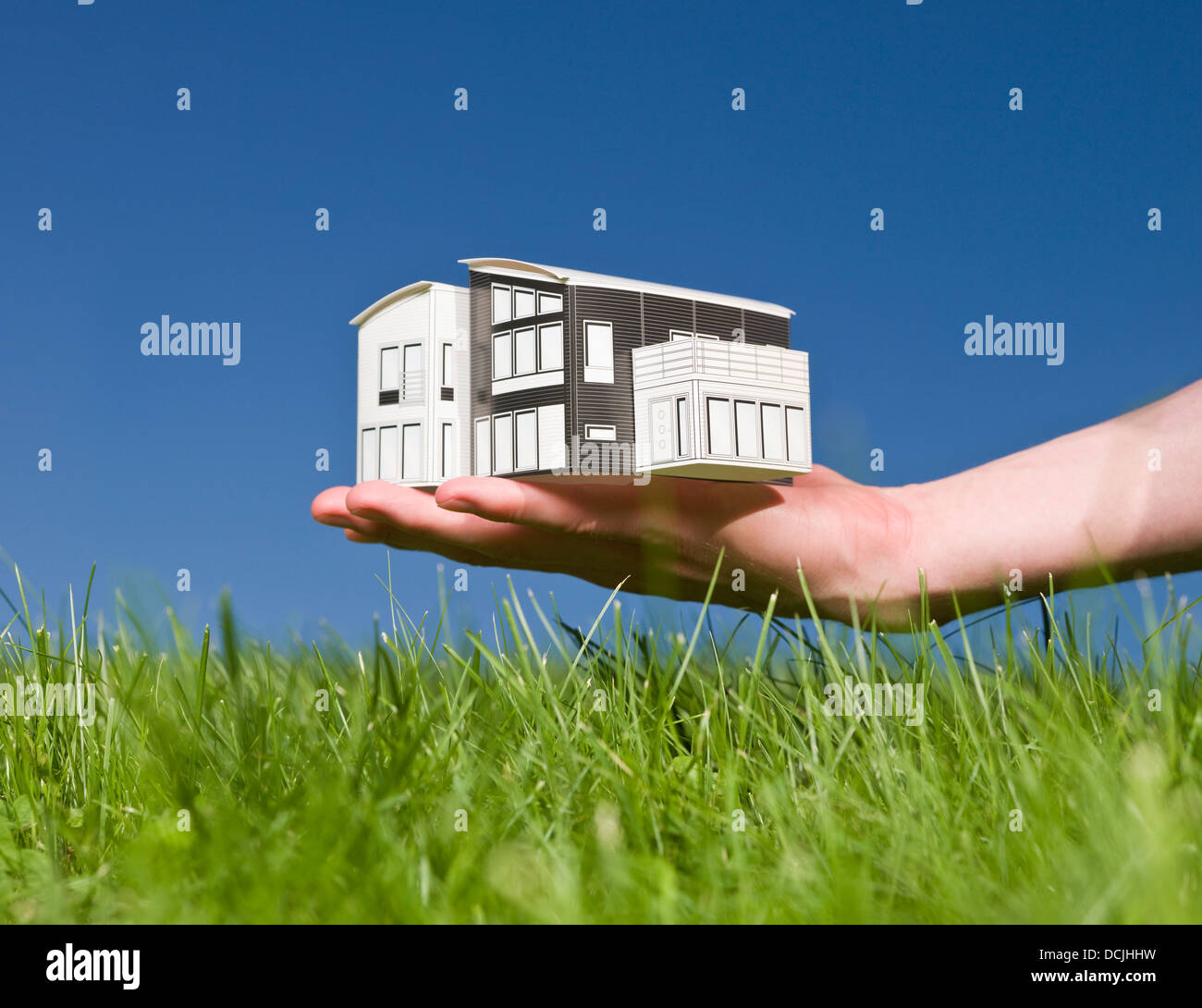 Hand holding a house Stock Photo - Alamy