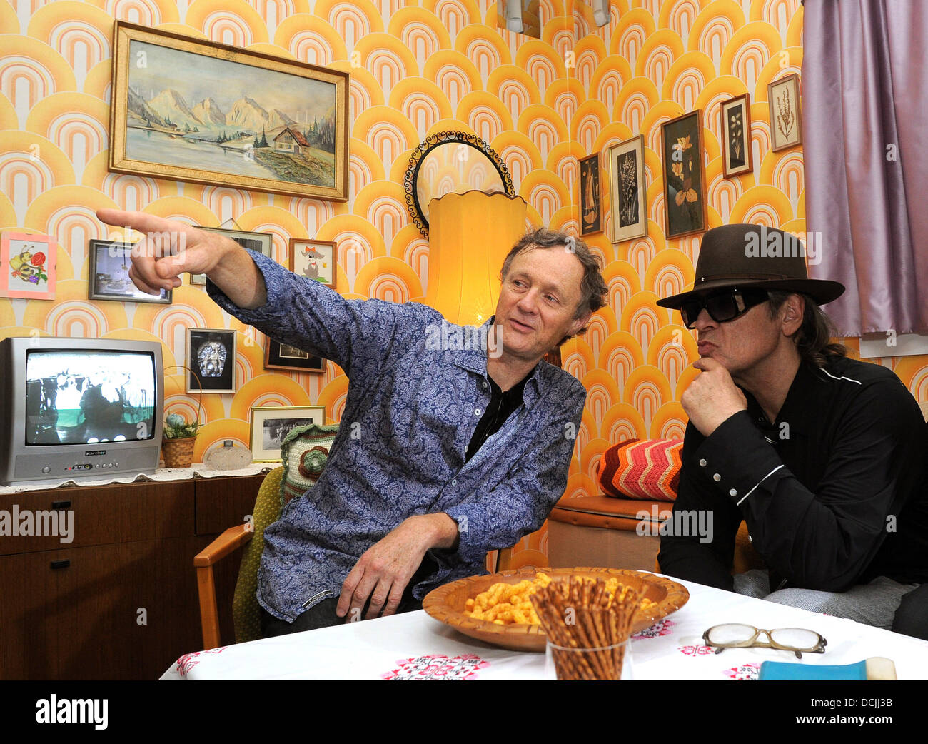 Artist Stefan Roloff (L) explains his installation 'Life in the death ...