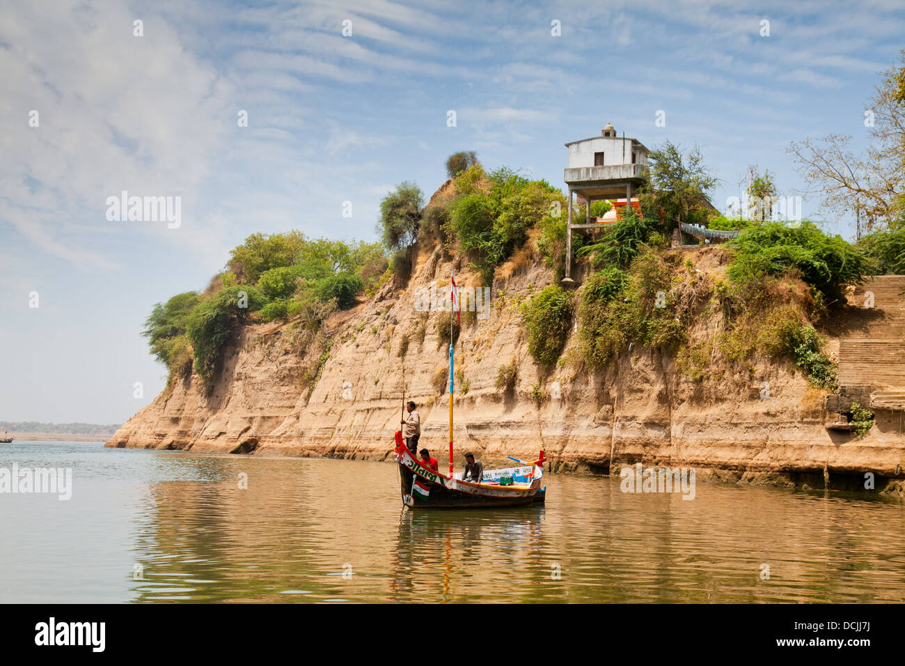 Men on boat over river Narmada at Chandod Ghat, Gujarat, India Stock ...