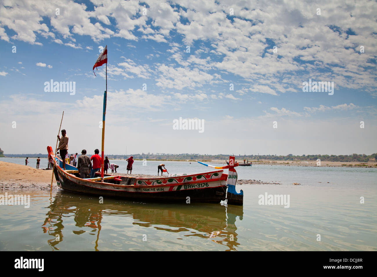 Men on boat over Narmada at Chandod Ghat, Gujarat, India Stock Photo ...