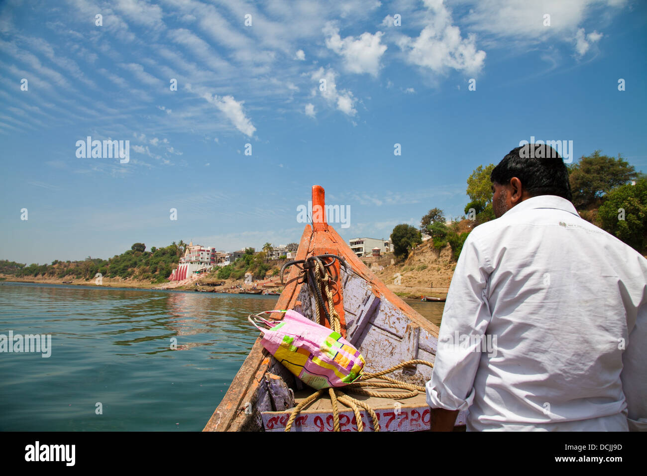 Man on boat over river Narmada at Chandod Ghat, Gujarat, India Stock ...