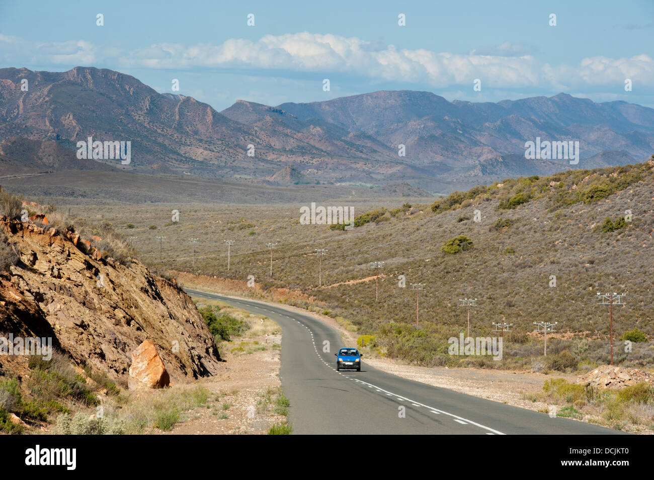 Road at the base of the Swartberg Mountains near Oudtshoorn, South ...