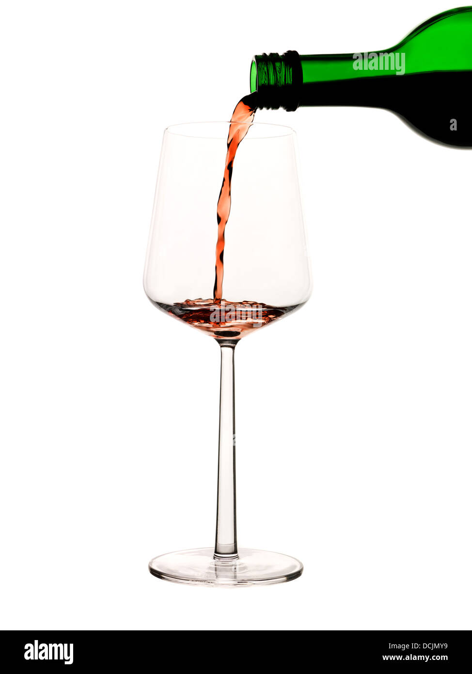 Puting red wine bottle to the glass Stock Photo - Alamy