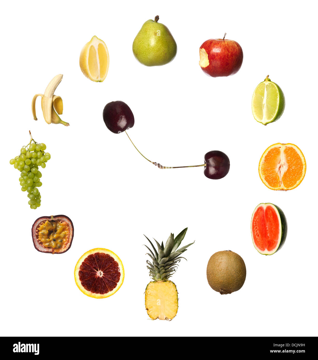 Fruit clock isolated on white Stock Photo - Alamy